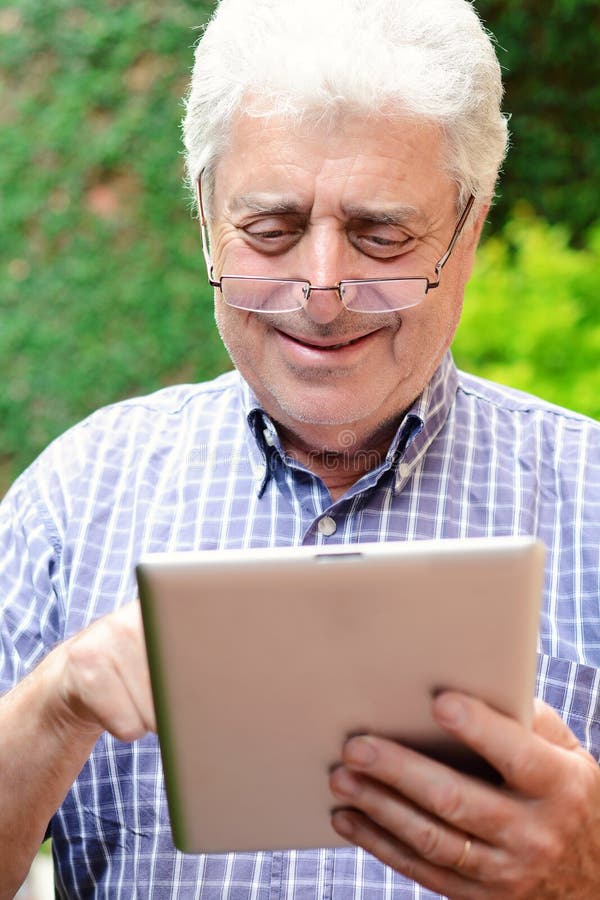 Old Man Using Digital Tablet. Stock Image - Image of expression ...