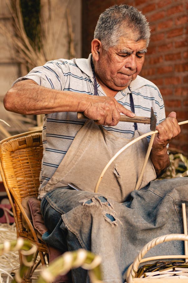 Old Man Using Hammer for Making Wicker Baskets at His Workshop Stock ...