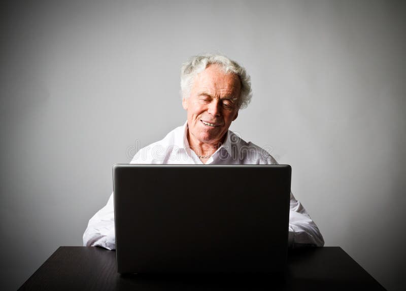 Old man using a laptop stock photo. Image of computer - 106165108