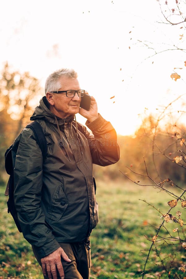 Old Man Using Smartphone in Forest Stock Image - Image of park, hobby ...