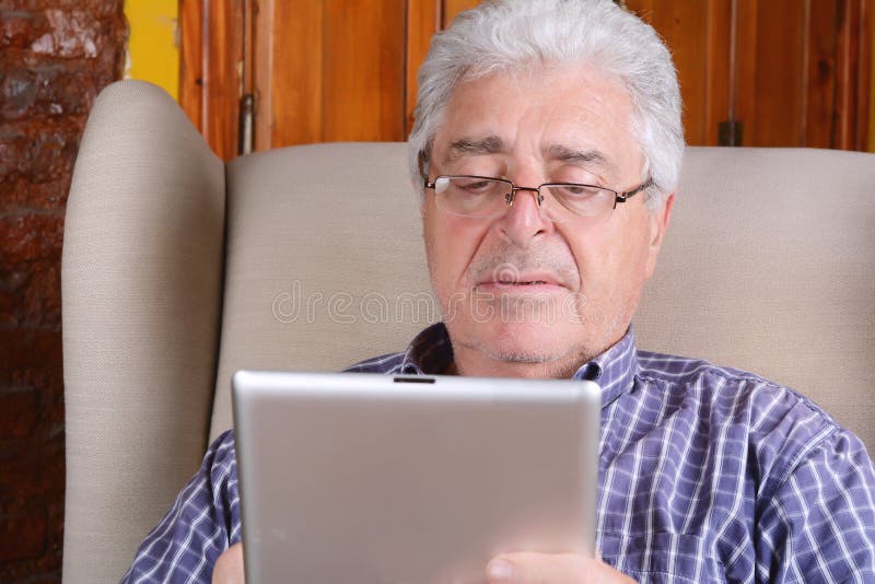 Old man using tablet. stock photo. Image of modern, caucasian - 90847840