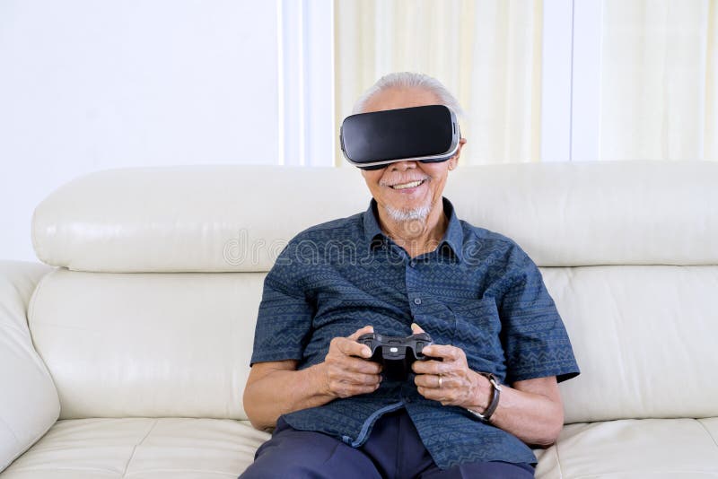 Old Man Using Virtual Reality Glasses and Joystick Stock Photo - Image ...