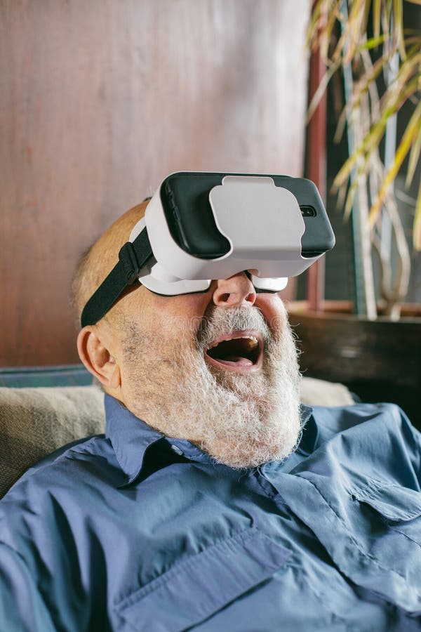 Old Man Using Virtual Reality Goggles at Home Stock Photo - Image of ...