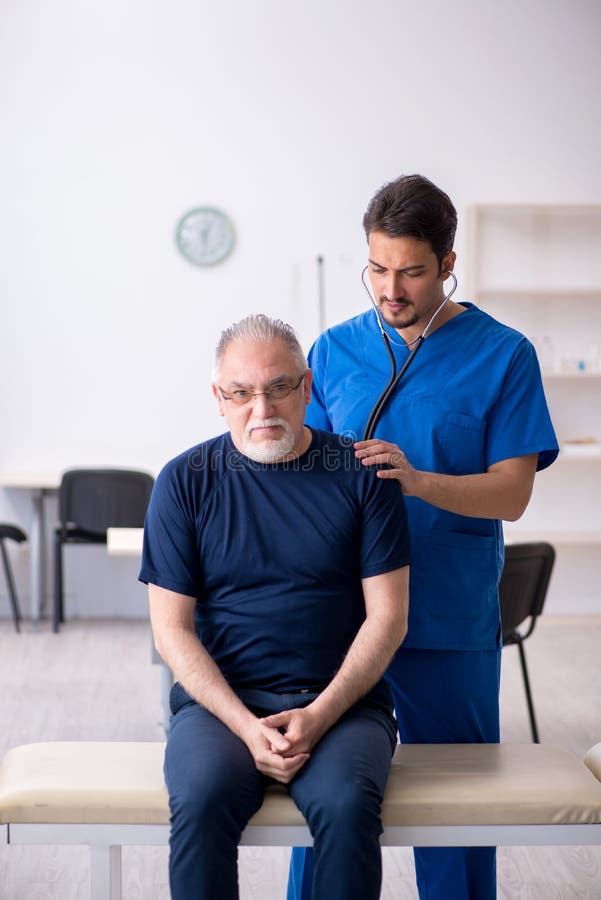 Old Man Visiting Young Male Doctor Stock Image - Image of specialist ...