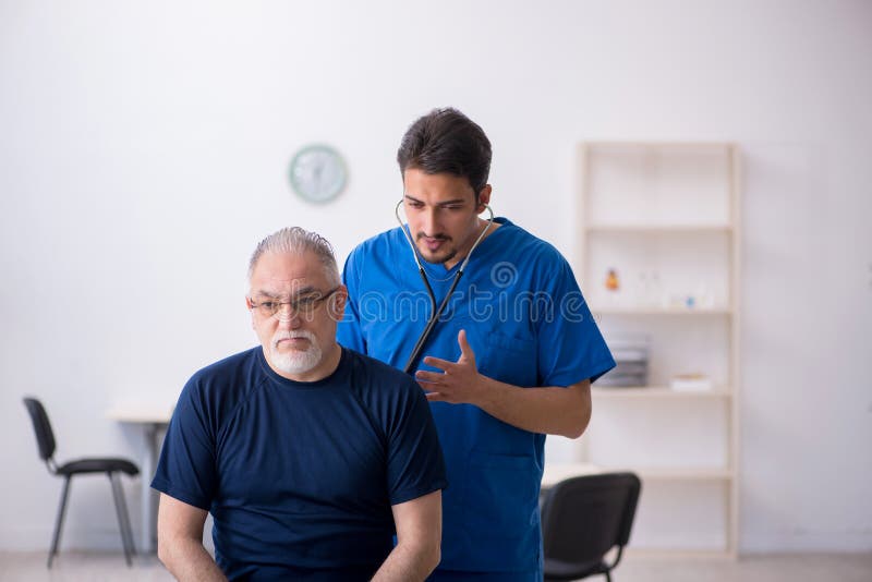 Old Man Visiting Young Male Doctor Stock Photo - Image of sick ...