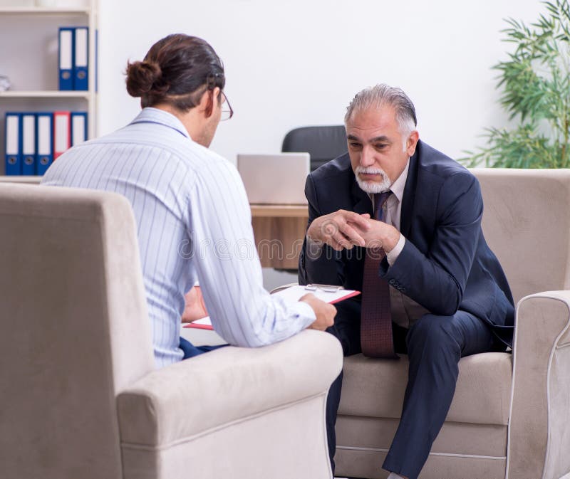 Old Man Visiting Young Male Doctor Psychologist Stock Image - Image of ...