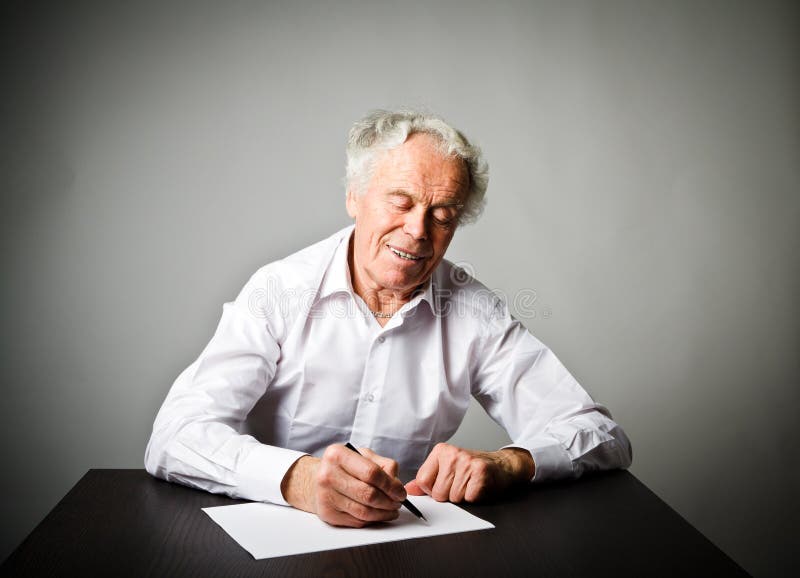 Old man is writing. stock image. Image of expression - 107205931