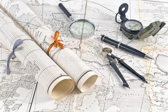 Old Maps in Rolls with Magnifier and Compass Stock Photo - Image of ...