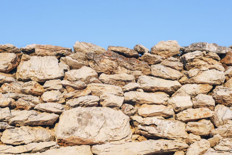 Old Masonry Stone Wall and Blue Sky Background, Texture Stock Photo ...