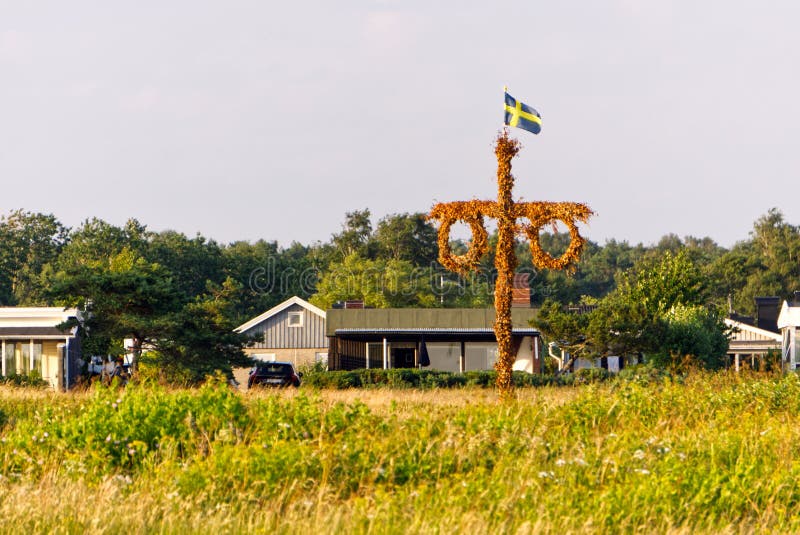 Old Maypole with Swedish Flag Stock Photo - Image of house, august ...