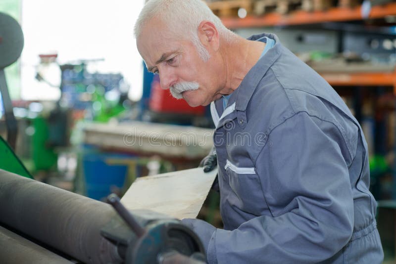 Old Mechanic Working in Factory Stock Photo - Image of manufacturing ...