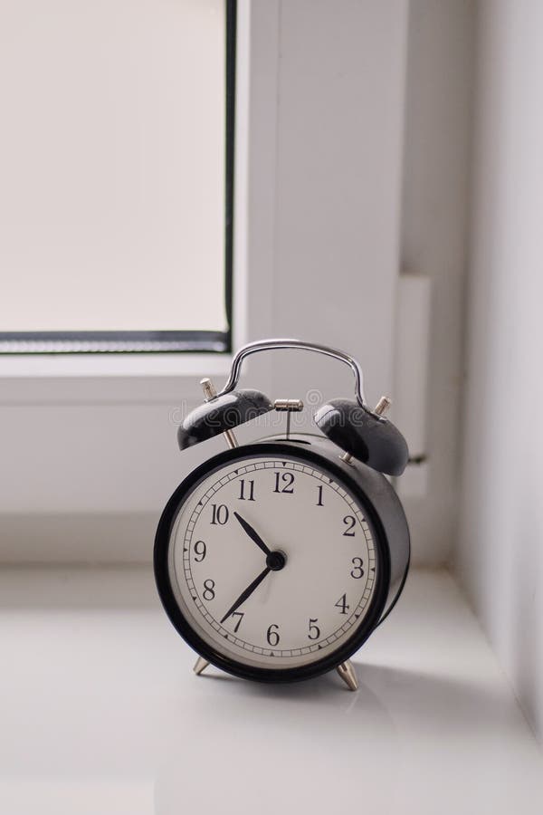 Old Mechanical Alarm Clock is on the Windowsill Stock Image - Image of ...