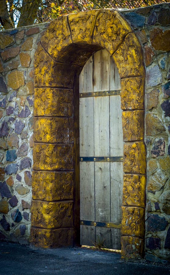 An Old Medieval Wooden Door with a Studded Forged Iron Frame Stock ...