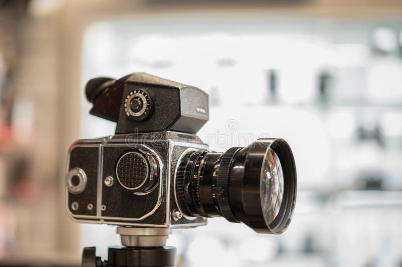 An Old Medium Format Camera with a Tripod on a Blurry Background Stock ...