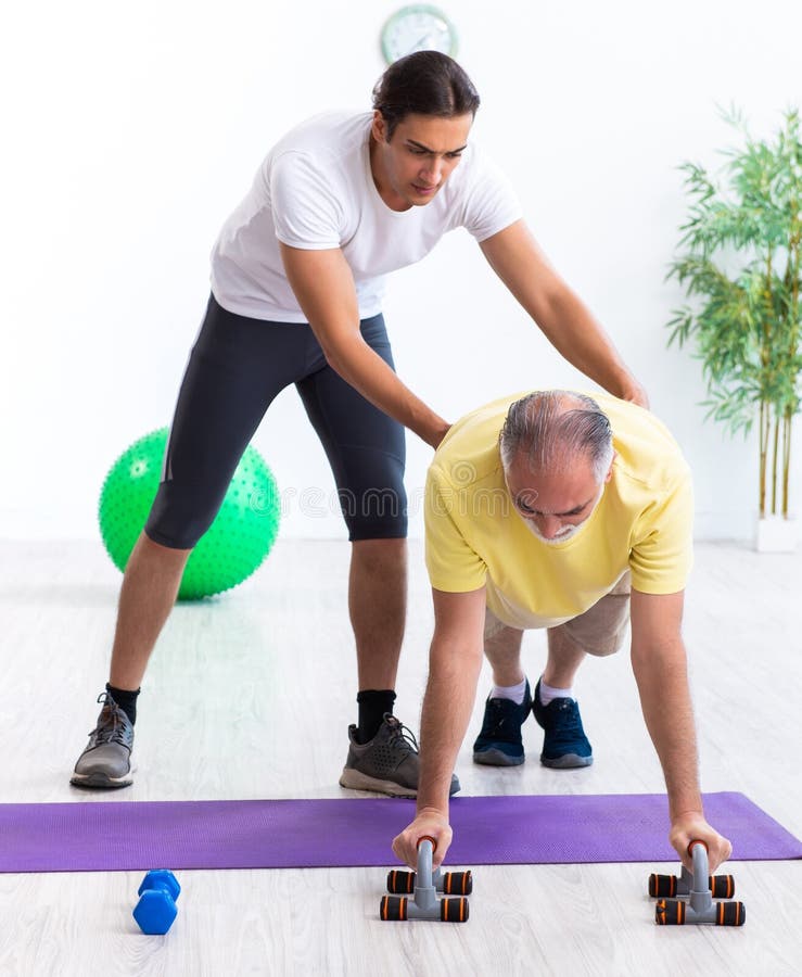 Old Man Doing Exercises Indoors Stock Photo - Image of athletic, floor ...