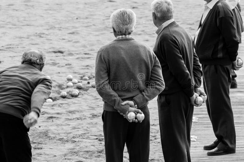 Old men playing petanque. editorial stock image. Image of sport - 58118604