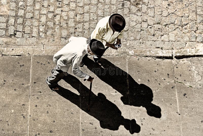 Old men with their shadows stock photo. Image of shadow - 9908898