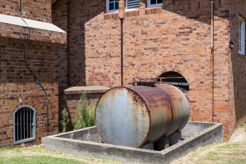 Old Metal Barrel in Front of a Stone Building Stock Image - Image of ...