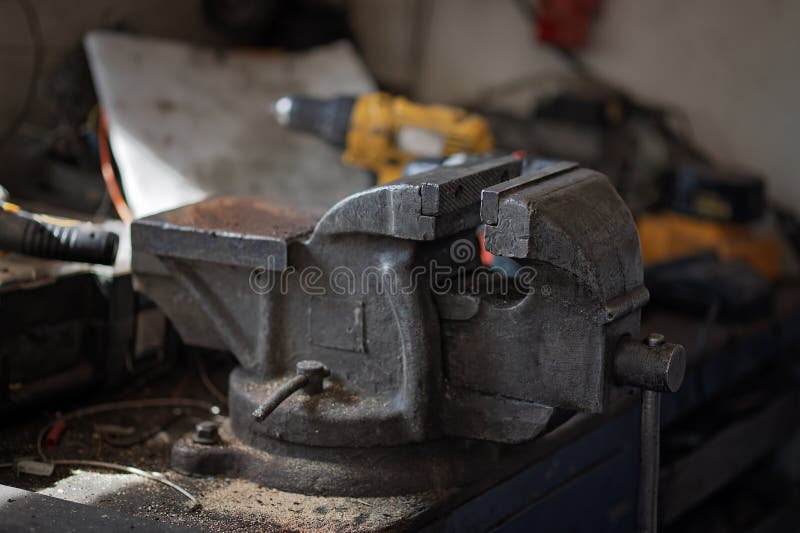 Old Metal Bench Vise Mounted on a Workbench in a Workshop Stock Image ...