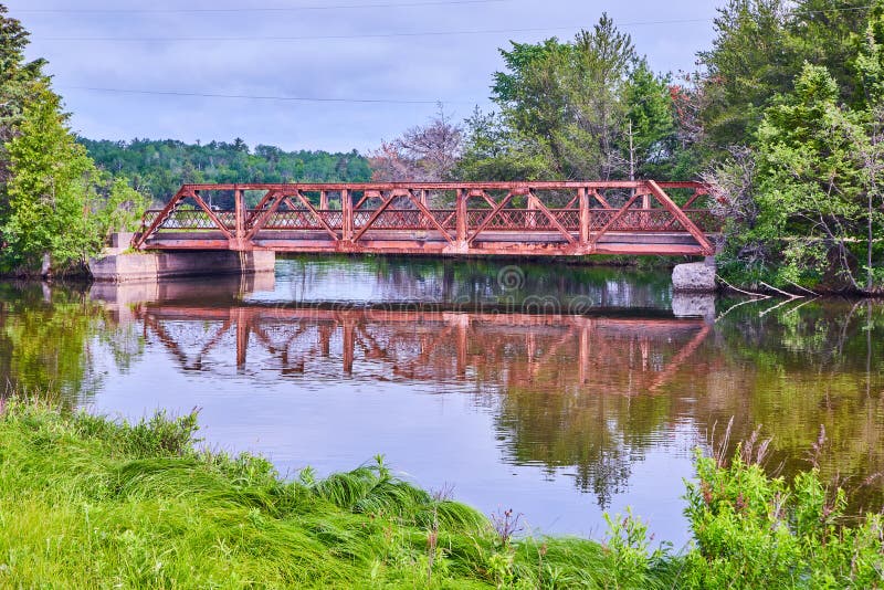 Old Metal Bridge Road Over River with Green Grass Stock Photo - Image ...