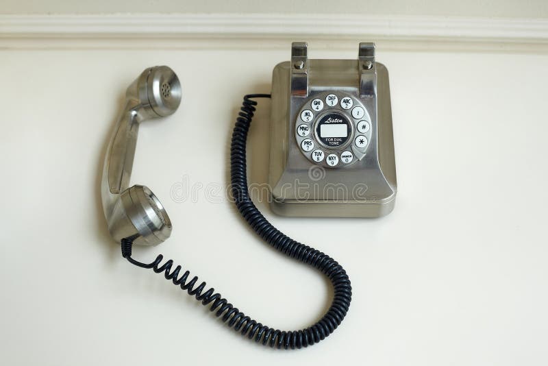 Old Metal Disc Phone with the Handset Removed Stock Photo - Image of ...