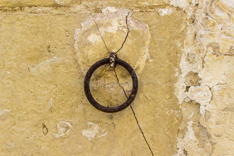 Old metal ring on the wall stock photo. Image of wall - 100591622