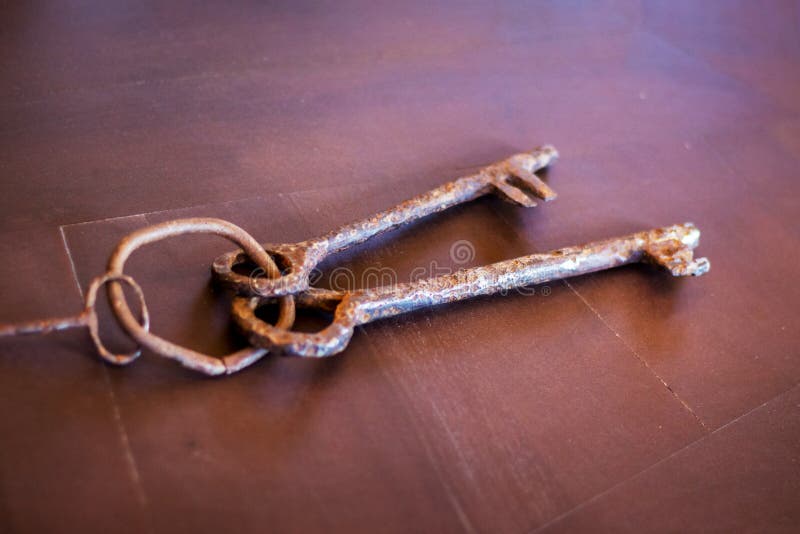 Old Metal Rusty Keys Lie on a Brown Table_ Stock Photo - Image of ...