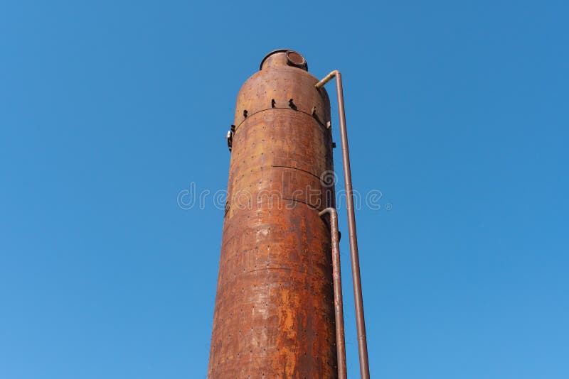 An Old Metal Rusty Water Tower. Old Production Technology, Processing ...