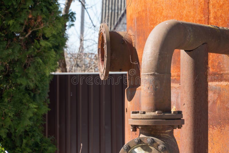 An Old Metal Rusty Water Tower. Old Production Technology, Processing ...