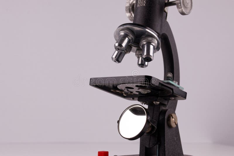 An Old Microscope Stands Isolated on a White Surface Stock Image ...
