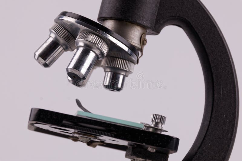 An Old Microscope Stands Isolated on a White Surface Stock Image ...