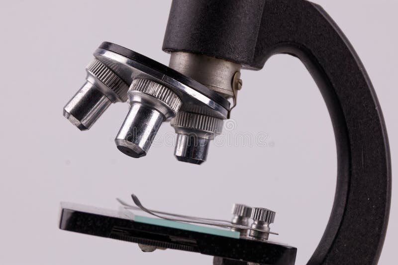 An Old Microscope Stands Isolated on a White Surface Stock Image ...