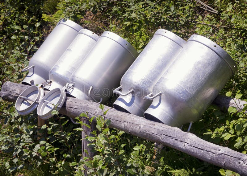 Old milk canisters stock image. Image of retro, objects - 37480295