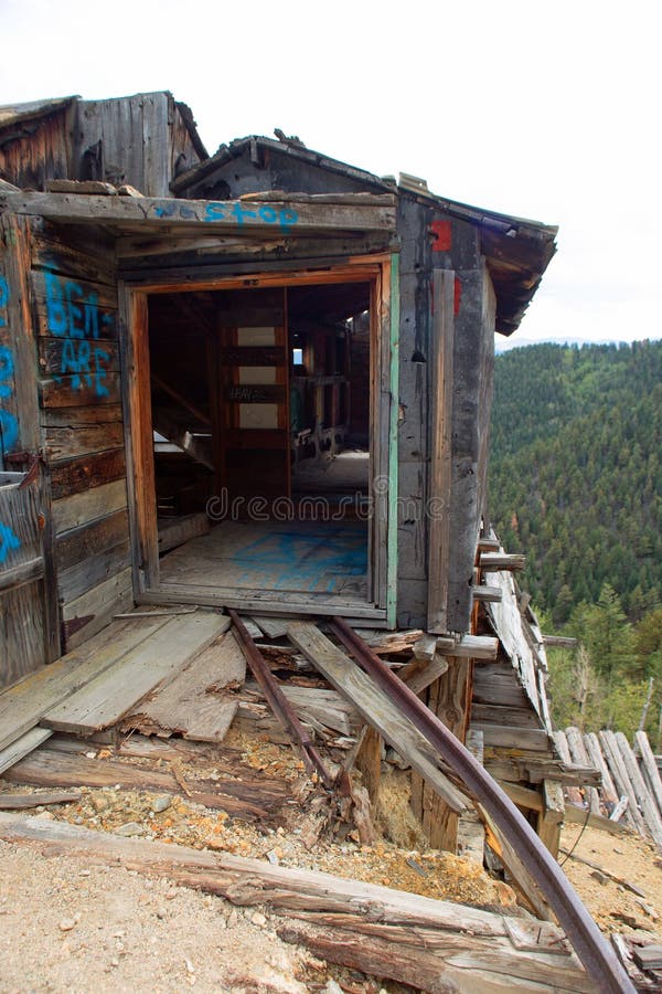 An Old Mining Shack Abandoned and with Graffiti Stock Photo - Image of ...