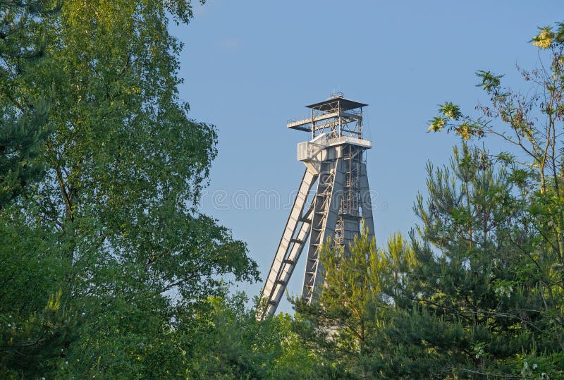Old Mining Tower of a Coal Mine in a Green Landscape with Trees in Warm ...