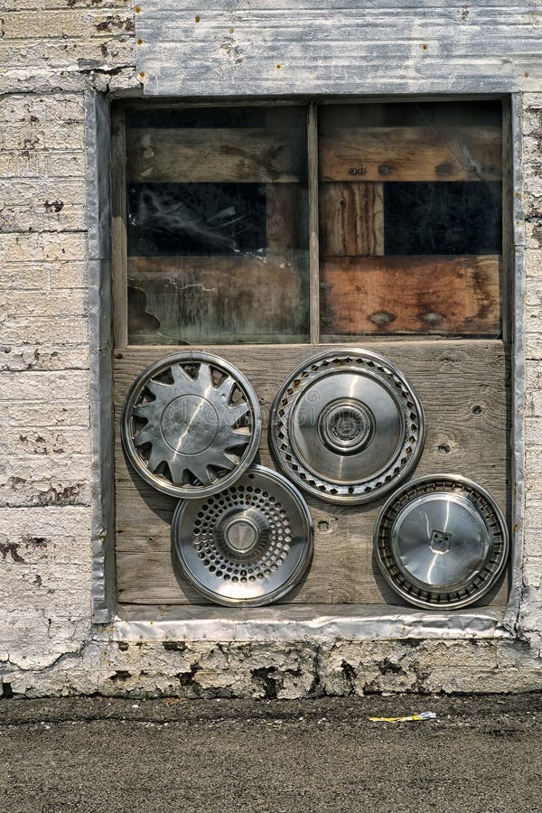 Old Mixed Hubcaps in a Window Editorial Photography - Image of tire ...
