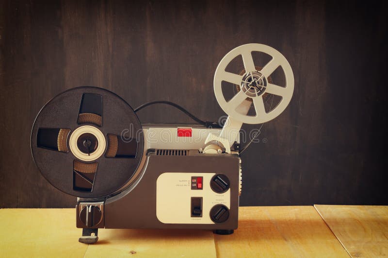 Old 8mm Film Projector Over Wooden Table and Textured Background Stock ...