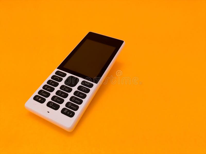 Old Mobile Phone Against a Bright Orange Backdrop Stock Photo - Image ...