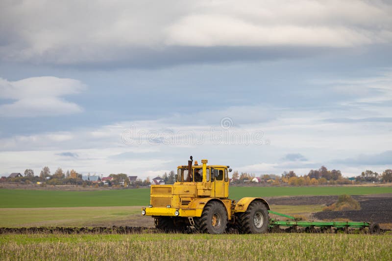 Old Model Tractor Working in the Field Stock Photo - Image of farm ...