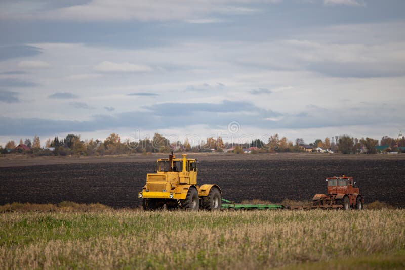 Old Model Tractor Working in the Field. Stock Image - Image of rubber ...