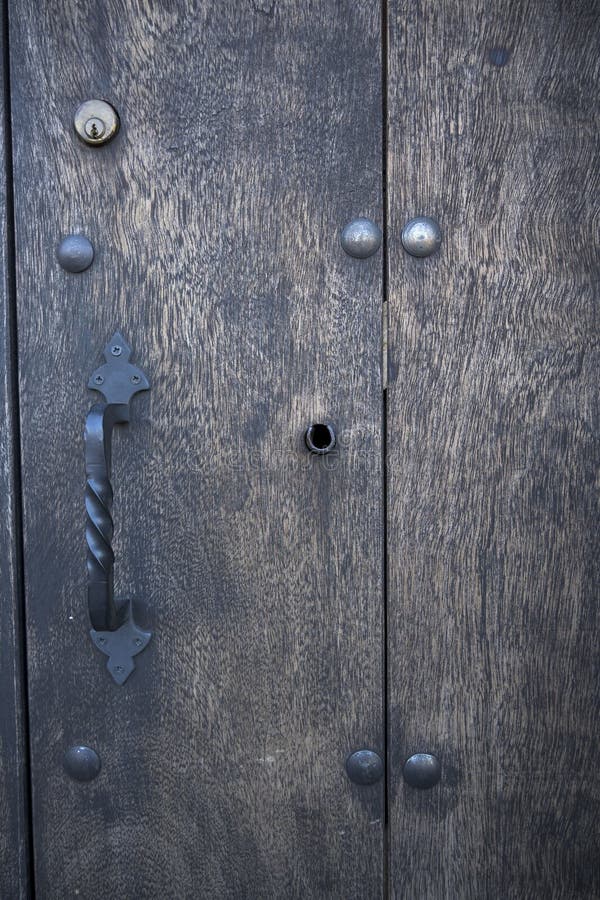 Old and Modern Lock on Old Dark Door with Iron Handle in Vertical Stock ...