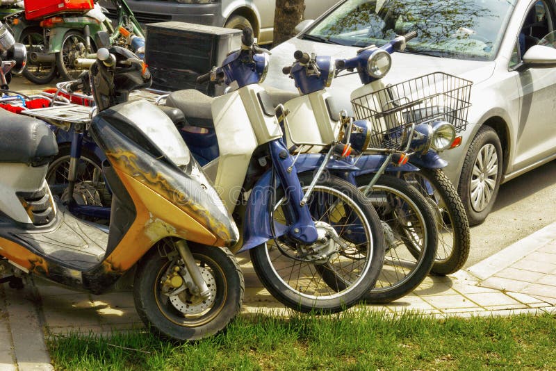 Old Mopeds and Scooters Parked Stock Image - Image of store, color ...