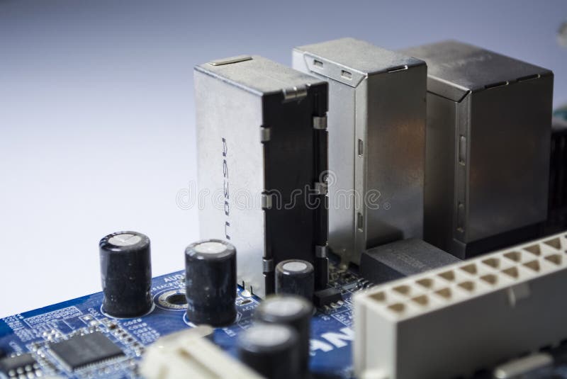 The Old and Dusty Motherboard from the Computer. Blue Color. Switches ...