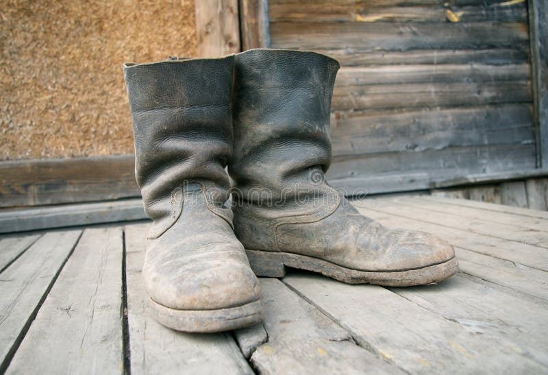 Old muddy farmers boots stock photo. Image of breeding - 5281290