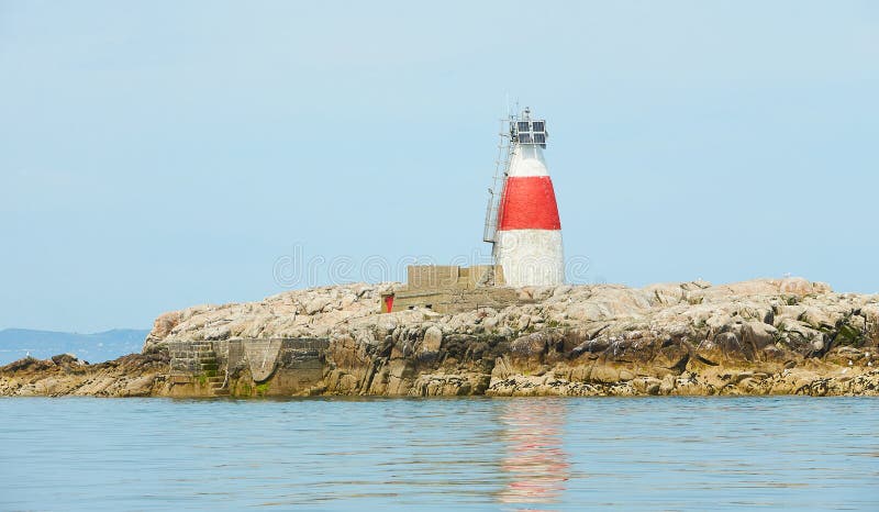 Old Muglins Lighthouse on the Isolated Island the Backdrop of the Blue ...