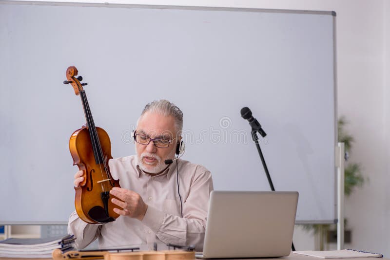 Old Male Music Teacher in the Classroom Stock Image - Image of ...