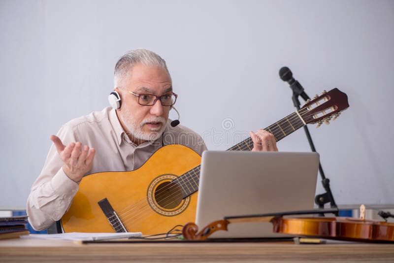 Old Male Music Teacher in the Classroom Stock Image - Image of music ...