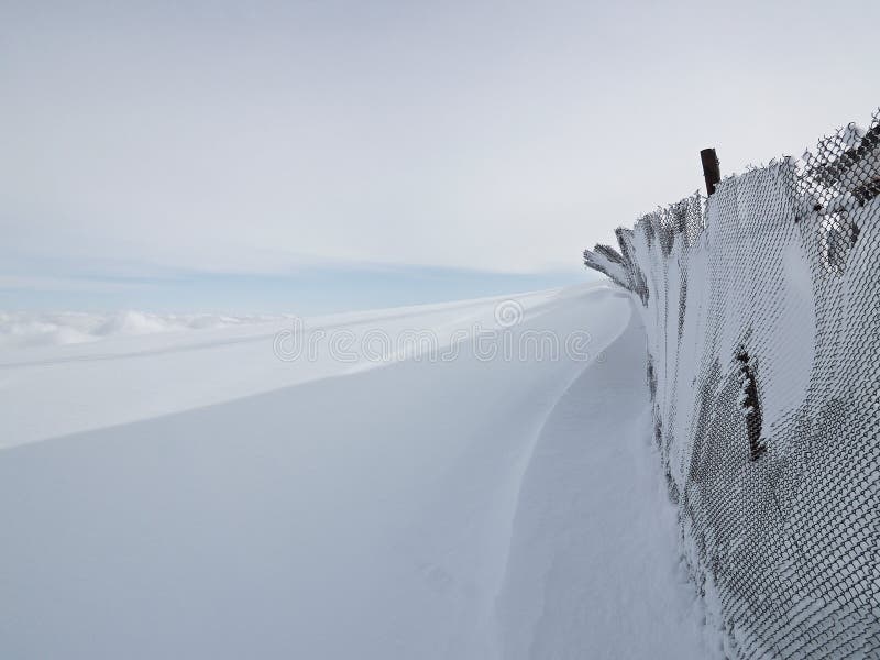 Old Netting Fence in the Snow Stock Image - Image of fence, solitary ...