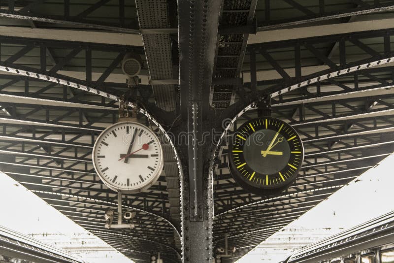 Old and New Clock Next To Each Other on the Platform of the Train ...