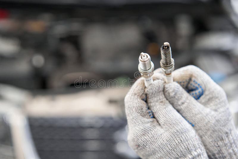 Old and New Spark Plugs. Comparing Spark Plugs the Maintenance of the ...